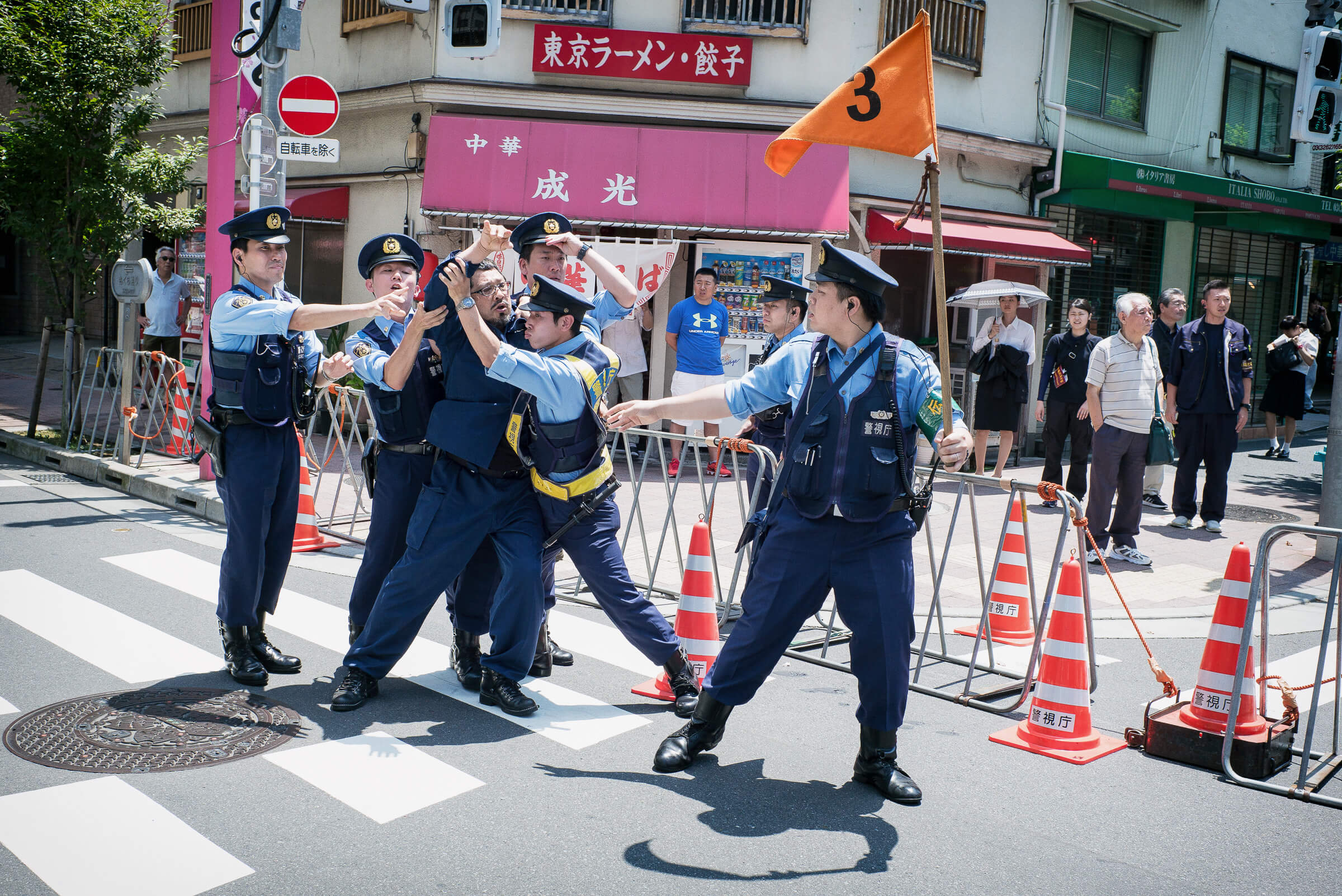 Japanese far-right nationalists and the police in comedy confrontations ...